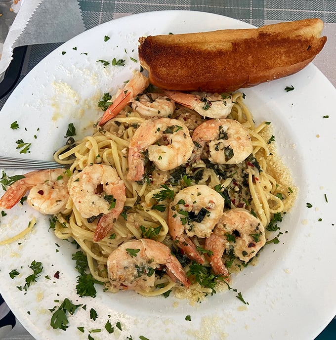 Shrimp scampi that demands to be photographed before eaten. Those plump crustaceans aren't just swimming in garlic butter—they're performing synchronized flavor ballet on your taste buds.