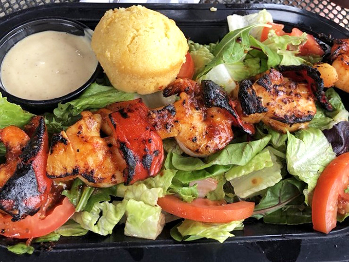 Who knew BBQ joints could nail seafood? These char-grilled shrimp skewers bring unexpected elegance to a place where sauce-stained shirts are badges of honor.