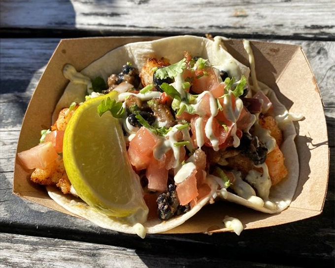 Taco Tuesday just found its forever home. Fresh seafood nestled in a tortilla with vibrant toppings and that crucial lime wedge for brightness.