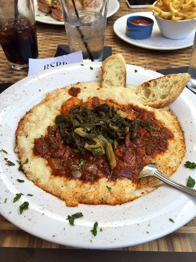 Shrimp and grits that would make a Southerner weep with joy. Those greens aren't just decoration&mdash;they're the supporting actors who deserve their own Oscar.
