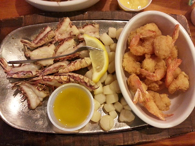 The seafood platter that launched a thousand road trips. Those split rock shrimp tails are the Florida equivalent of striking gold.
