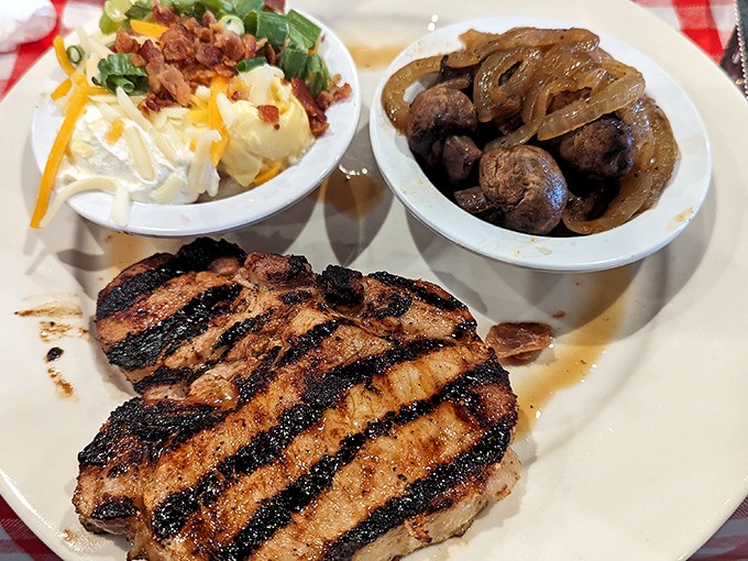 A perfectly grilled sirloin with those coveted crosshatch marks, flanked by loaded mashed potatoes and saut&eacute;ed onions. Meat-lover's poetry on a plate.