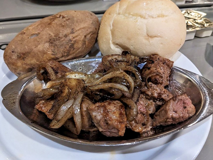 Sirloin tips with grilled onions&mdash;the working-class hero of the steak world. Simple, unpretentious, and absolutely delicious with that pillowy roll standing guard.