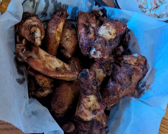 Smoked wings that look like they've been kissed by the gods of fire and flavor. No dainty nibbling here&mdash;these demand joyful, messy commitment.