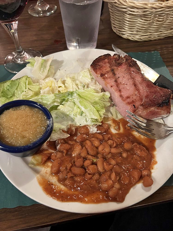 This smoked pork chop isn't just dinner&mdash;it's edible poetry. The beans aren't a side dish; they're a supporting actor deserving their own award.