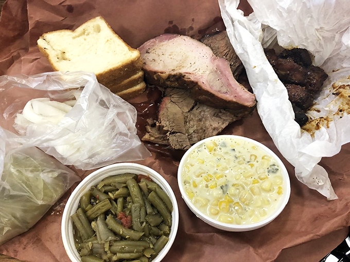 Smoke-kissed meat nestled in humble butcher paper&mdash;proof that the best dining experiences often come without fancy china or pretension.