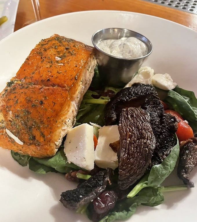 Salmon that doesn't just flake&mdash;it practically narrates its own journey from stream to plate, accompanied by roasted mushrooms that deserve their own fan club.