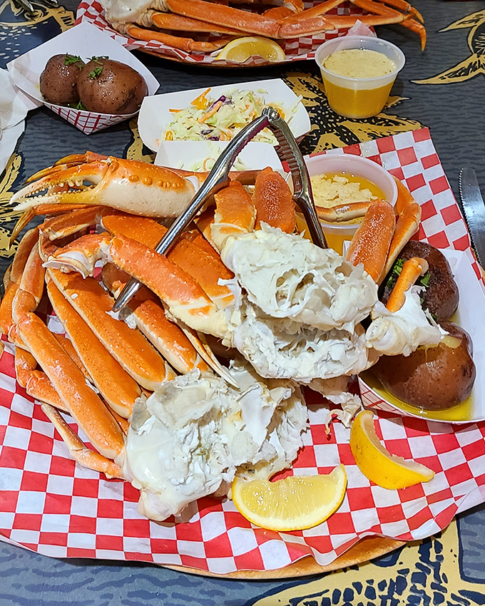 Snow crab legs: Nature's way of saying "work a little for something extraordinary." The red-checkered paper is your battlefield.