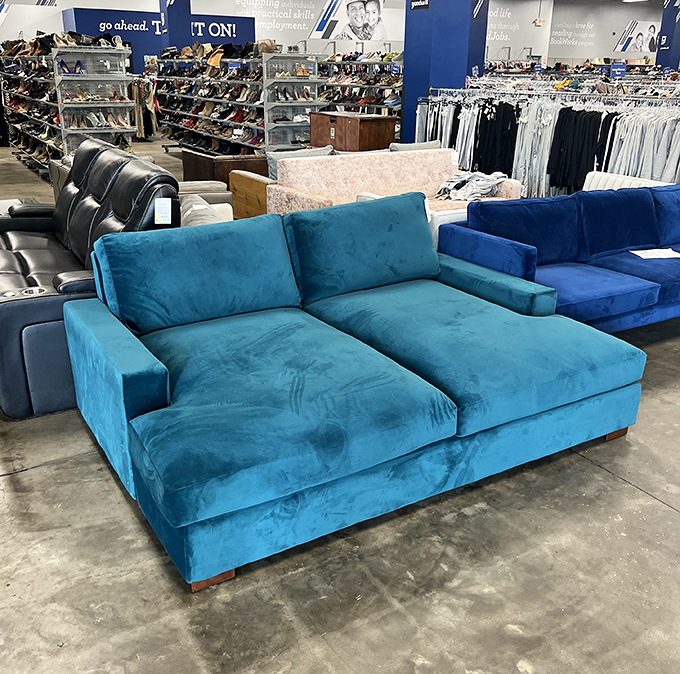 That turquoise sectional isn't just a sofa&mdash;it's your next nap headquarters. Quality furniture finds make this Goodwill a decorator's secret weapon.