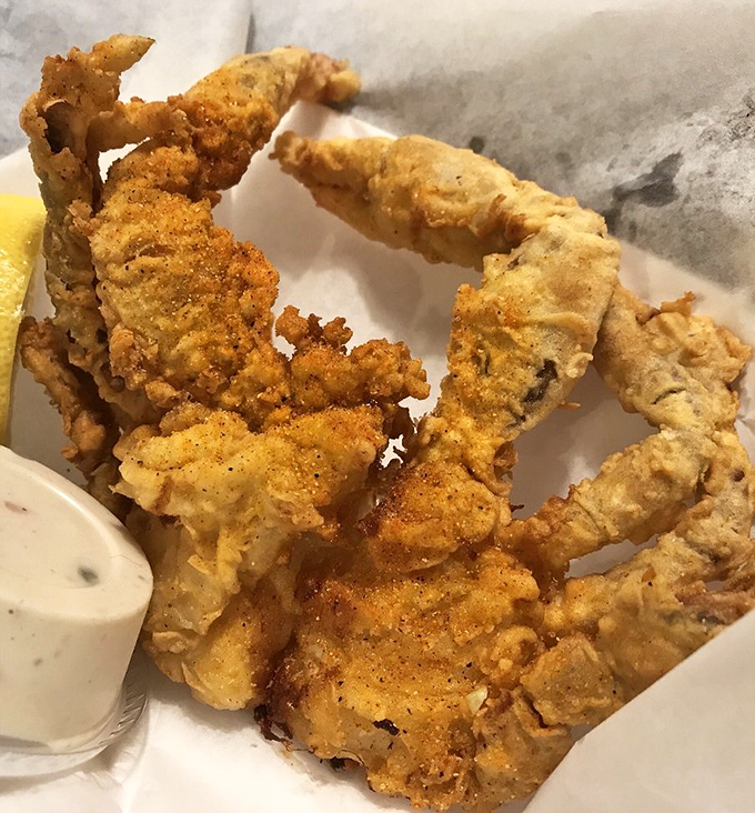 Soft shell crab wearing a golden-fried jacket that shatters with each bite. The dipping sauce isn't necessary, but refusing it would be foolish.