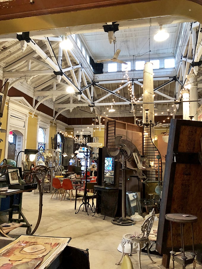 The soaring cathedral-like ceiling creates a treasure hunter's paradise where industrial meets elegant, and every item has survived decades to find you.