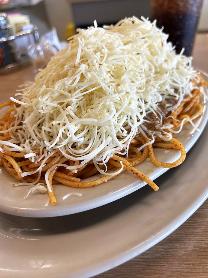 Behold the 3-way in all its glory&mdash;spaghetti buried under an avalanche of finely shredded cheese that's practically applying for its own zip code.