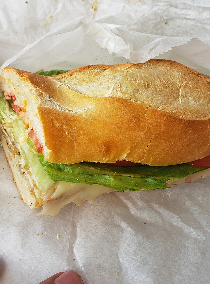 A perfect Italian hoagie in its natural habitat &ndash; crisp lettuce, quality meats, and that bread! This is sandwich architecture at its finest.