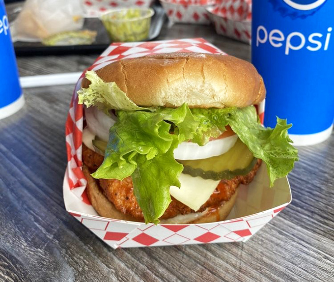 The spicy chicken sandwich stands tall and proud, its crispy exterior giving way to juicy tenderness within. The perfect alternative for non-beef days.
