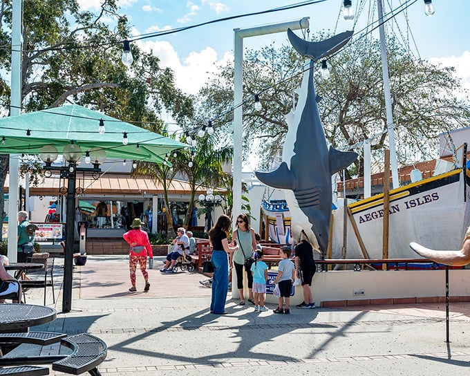 The iconic shark sculpture welcomes visitors to the Sponge Exchange, where "getting caught" means finding treasures you didn't know you needed.