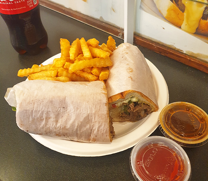 The steak and cheese wrap arrives with a side of crispy fries that somehow manage to stay crispy&mdash;a culinary magic trick worth the trip alone.