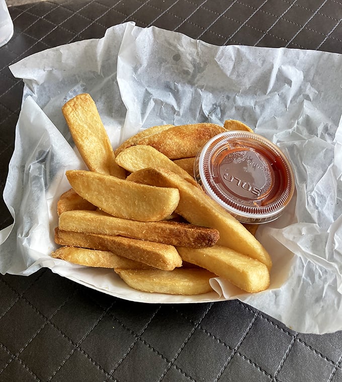 Fries that understand their supporting role but still deserve a standing ovation. Crisp, golden, and ready to soak up any wayward tartar sauce or ketchup.