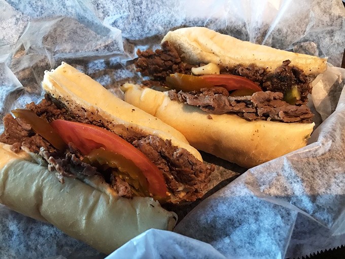 The steak sandwich arrives like a meaty celebration &ndash; tender beef, fresh tomatoes, and those pickles adding just enough tang to make your taste buds dance.