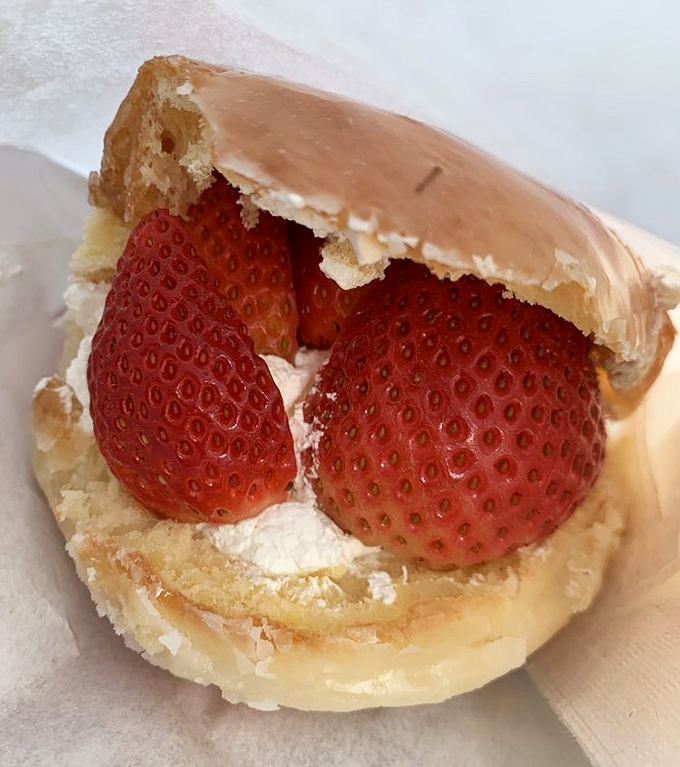 Split open like a good novel, revealing the plot twist inside. These strawberry cream donuts prove that fruit can absolutely count as breakfast when nestled in fresh pastry.