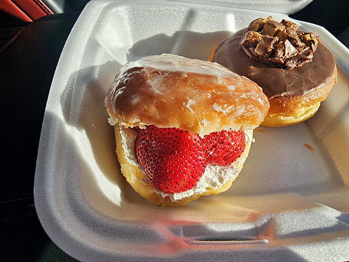 Strawberry cream donut sitting pretty next to its chocolate companion&mdash;like breakfast and dessert decided to have a beautiful friendship.
