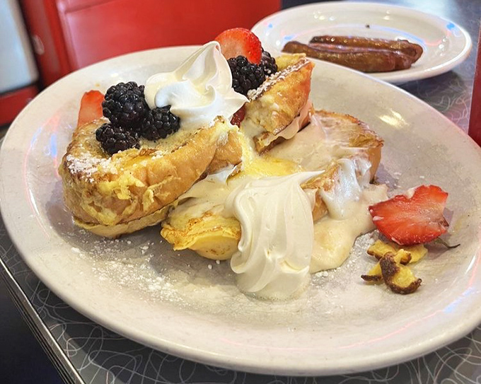French toast stuffed with cream cheese filling and crowned with fresh berries &ndash; breakfast that thinks it's dessert, and nobody's complaining.