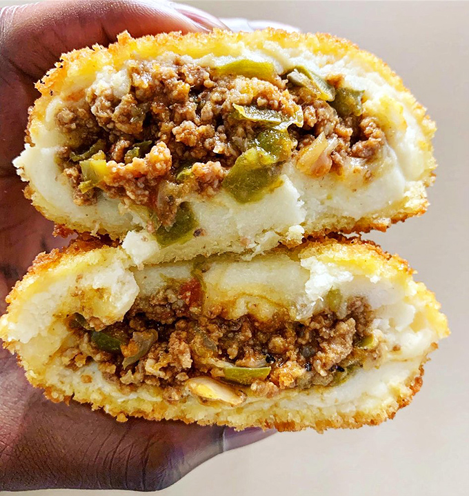 The stuffed potato isn't just a side dish, it's a main event. This carb-loaded masterpiece with seasoned meat filling would make any Idahoan weep with joy.