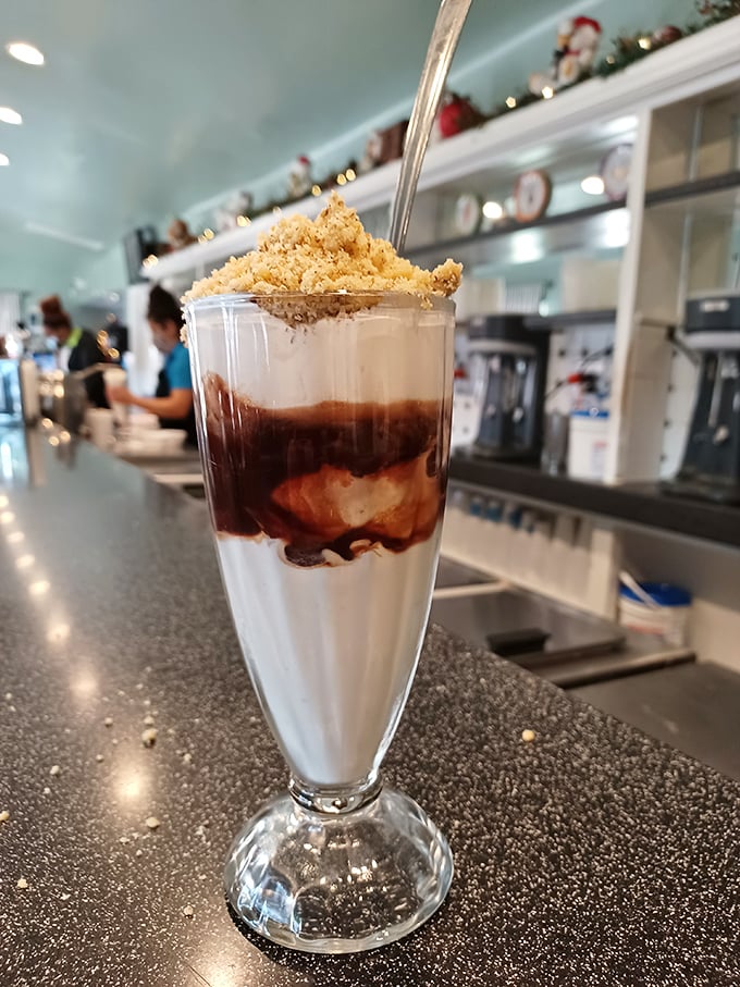 Layers of vanilla, hot fudge, and what appears to be graham cracker crumbs&mdash;architectural perfection that would make Frank Lloyd Wright weep with joy.