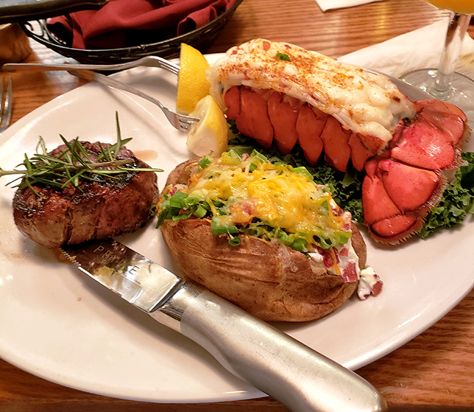 Surf meets turf in this showstopping plate where lobster tail and filet mignon compete for your attention, while a loaded baked potato referees the delicious standoff.