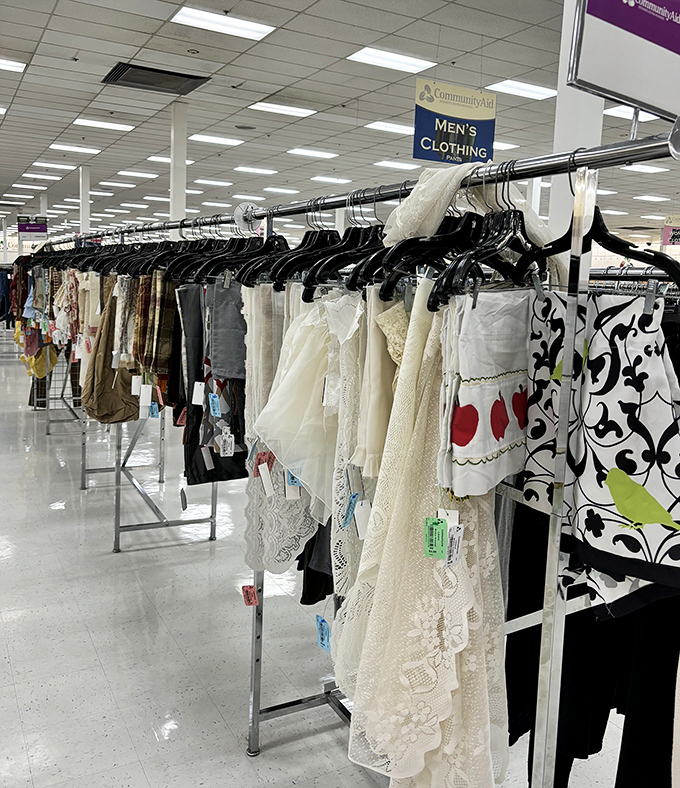 Delicate lace and vintage fabrics hang in elegant rows, whispering stories of formal dinners and special occasions from decades past.