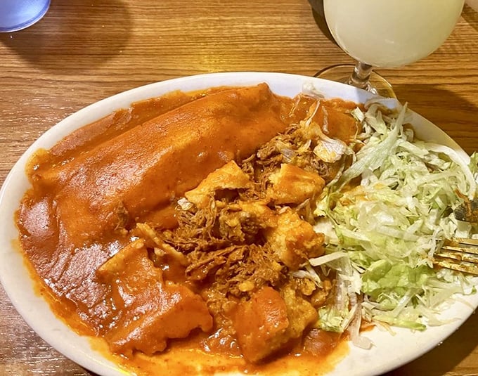 These tamales arrive like little presents wrapped in corn husks, hiding treasures of seasoned perfection inside.