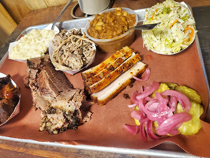 A Texas-sized platter that makes vegetarians question their life choices. The holy trinity: brisket, beans, and that legendary mac.
