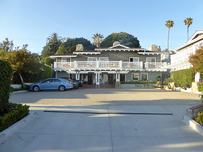 The Inn on Summer Hill welcomes visitors with classic coastal architecture and a porch that practically demands you sit down with a good book.