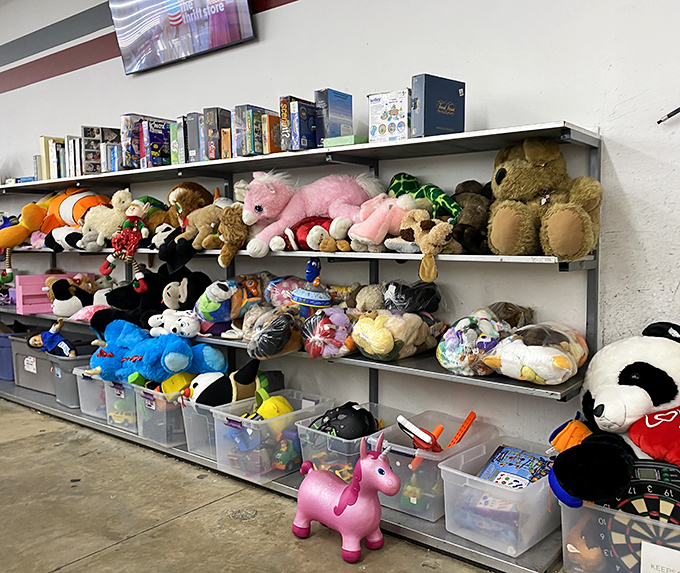 
Stuffed animals lined up like hopeful orphans waiting for adoption. That pink unicorn has seen things, but still has plenty of cuddles left to give. 
