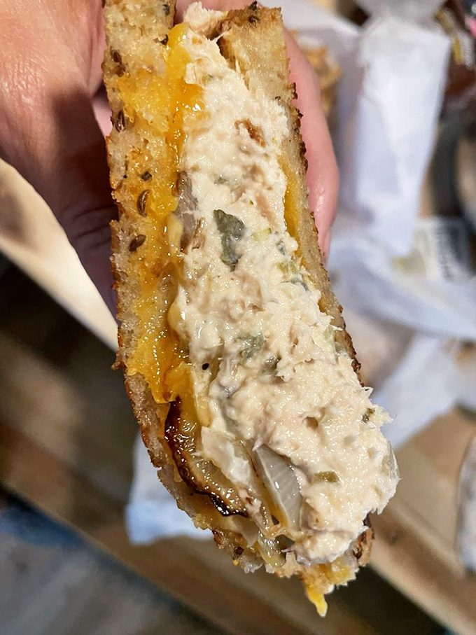 Tuna salad elevated to an art form. Between those perfectly toasted slices lies a sandwich that puts deli chains to shame.