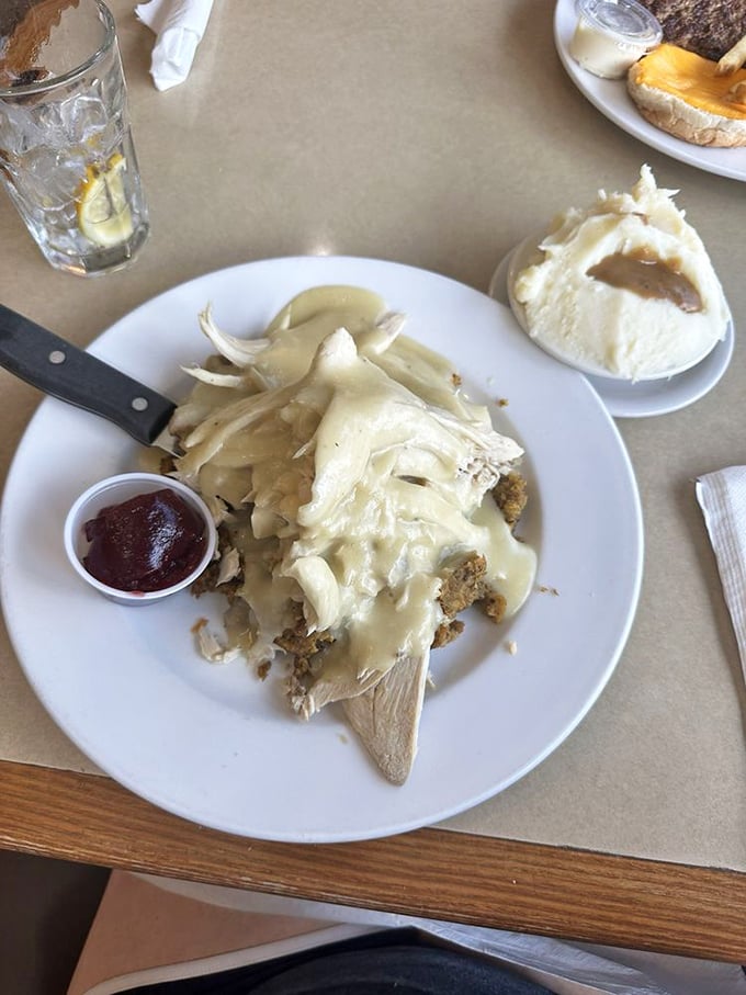 Thanksgiving on a plate! This open-faced turkey sandwich smothered in gravy is the comfort food equivalent of a warm hug from your favorite aunt.