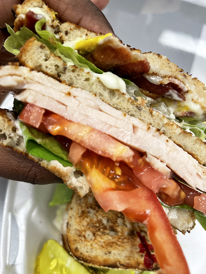 Layer upon glorious layer, this turkey club isn't just a sandwich&mdash;it's a skyscraper of flavor that requires strategic eating techniques.