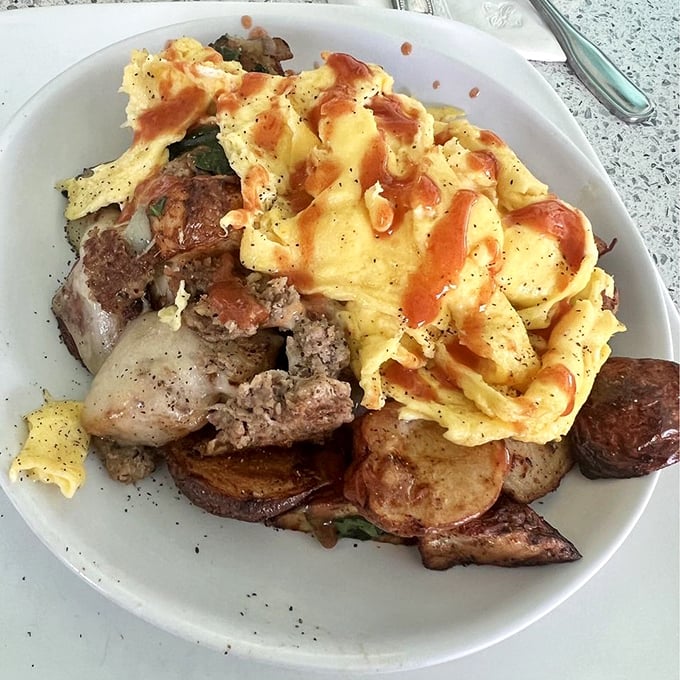 This skillet doesn't just feed your hunger&mdash;it tells a story of perfectly seasoned meats, eggs, and potatoes in harmonious breakfast matrimony.