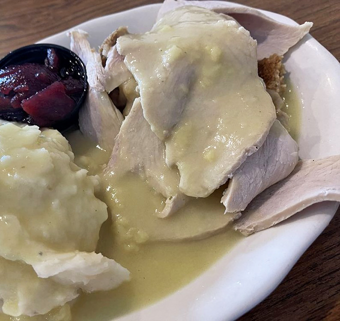 Thanksgiving on a plate doesn't need a holiday&mdash;tender turkey swimming in gravy with mashed potatoes playing the perfect supporting role.