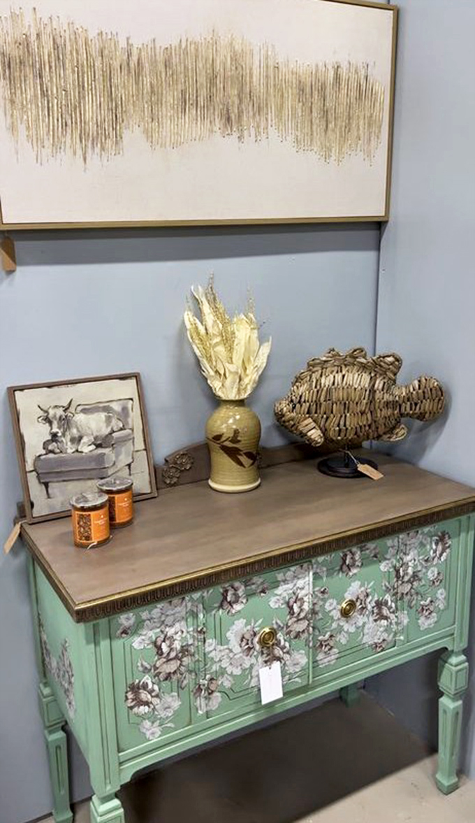 Mid-century meets coastal in this seafoam cabinet vignette. The woven fish seems to ask, "Wouldn't I look fabulous in your guest bathroom?" 