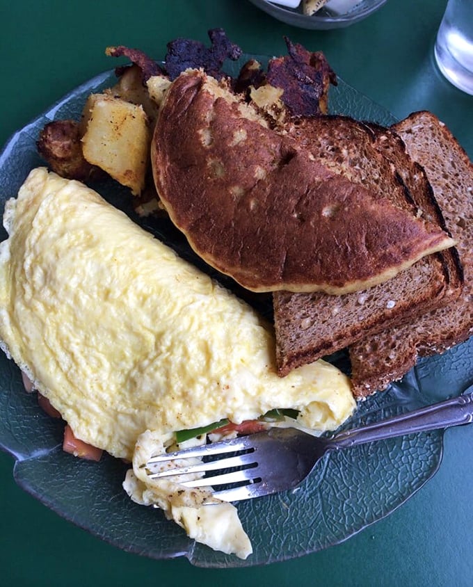 An omelet so fluffy it could double as a pillow, paired with home fries that have achieved that mythical balance of crispy exterior and tender interior.