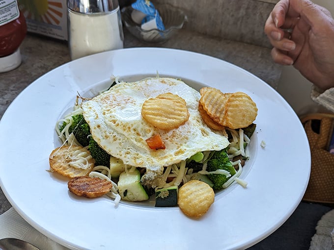 Vegetables trying to convince you they're health food while hiding under a perfectly fried egg&mdash;the ultimate breakfast disguise.