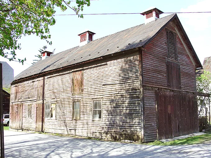 This weathered barn holds decades of stories in its wooden walls, standing testament to simpler times.