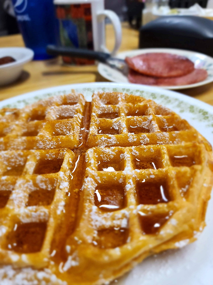 Waffle architecture at its finest&mdash;perfectly formed squares creating pockets for maple syrup pools. That's not breakfast, that's edible geometry.