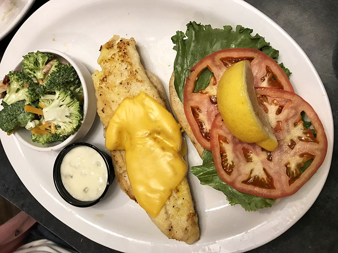 Fresh walleye draped with melted cheese alongside vibrant vegetables&mdash;proof that sometimes the simplest preparations let great ingredients shine brightest.