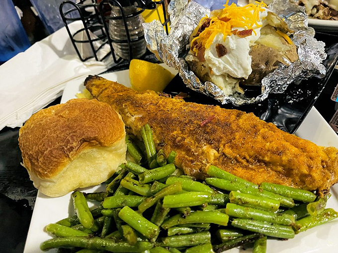 A perfectly golden walleye fillet that practically begs to be photographed before it's devoured, accompanied by vibrant green beans that didn't come from a can.