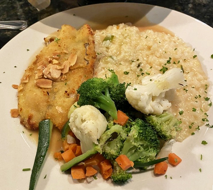 The walleye amandine arrives like a golden sunset on your plate, proving Ohio knows its way around exceptional seafood.