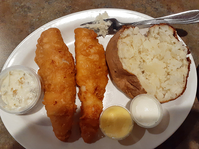 Golden-battered walleye that breaks apart with the gentlest touch of a fork, served with a baked potato that's basically a blank canvas for butter.