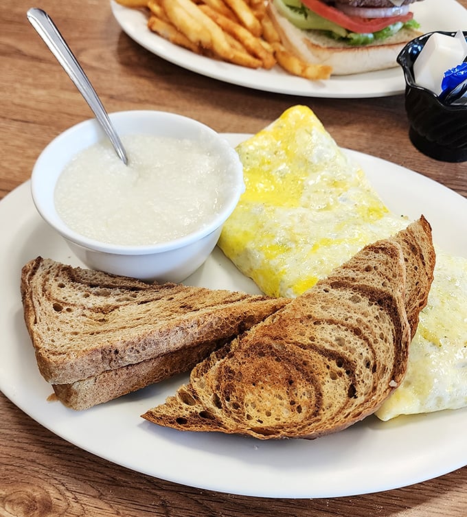 The Western omelet arrives like a golden envelope stuffed with morning promises, accompanied by toast that's achieved that elusive perfect shade of brown.
