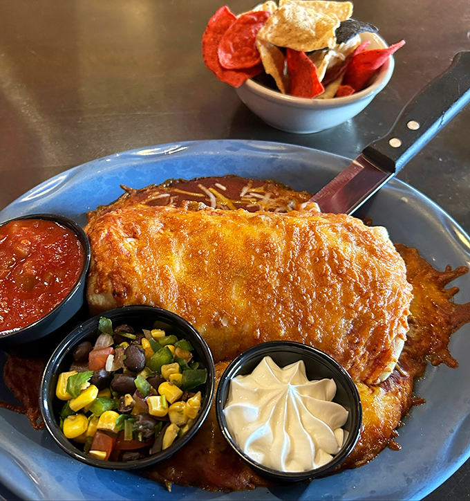A burrito that's had a proper Michigan baptism. The cheese blanket, the colorful sides&mdash;this plate is throwing a fiesta and your mouth is invited.
