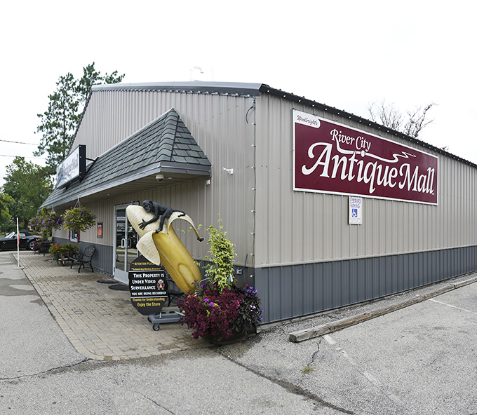 The River City Antiques Mall announces itself with vintage flair &ndash; that giant dental chair outside is either quirky advertising or a monument to root canal history.
